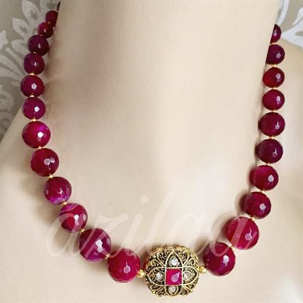 Pinkish maroon gemstone handmade golden necklace set at ₹2950 | Azilaa